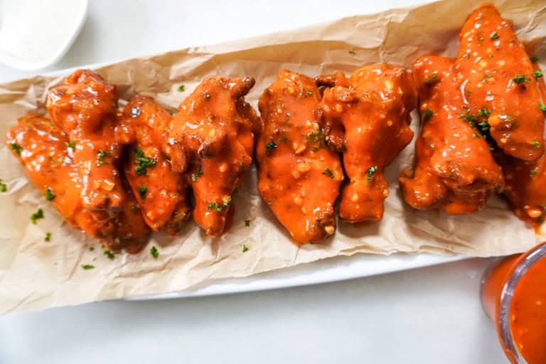 Super Crispy Oven Baked Chicken Wings in Buffalo Sauce - Razzle Dazzle Life
